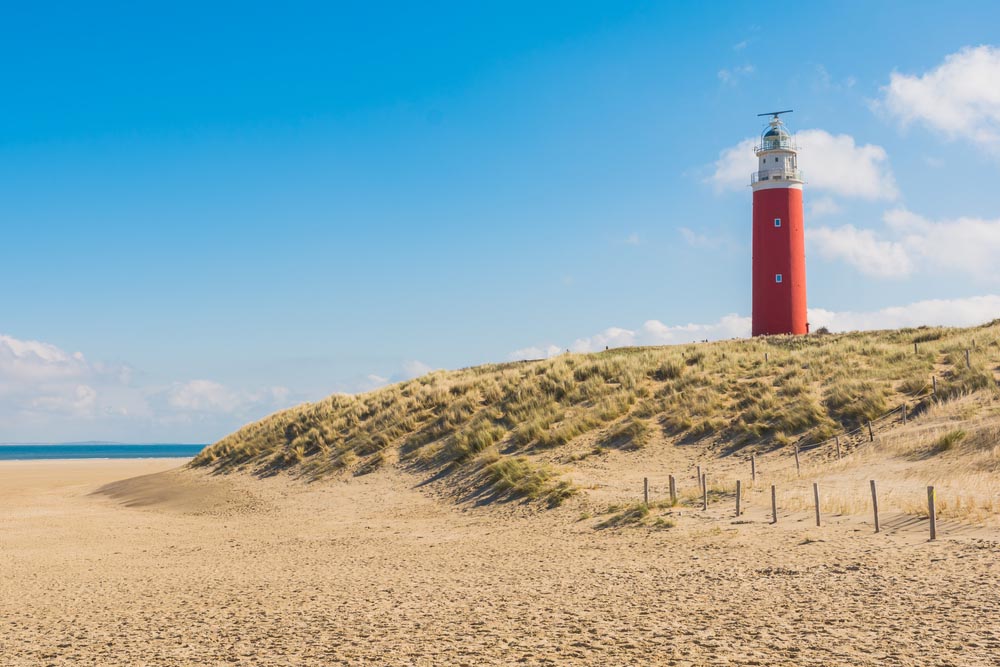 Fotobehang Strand en vuurtoren